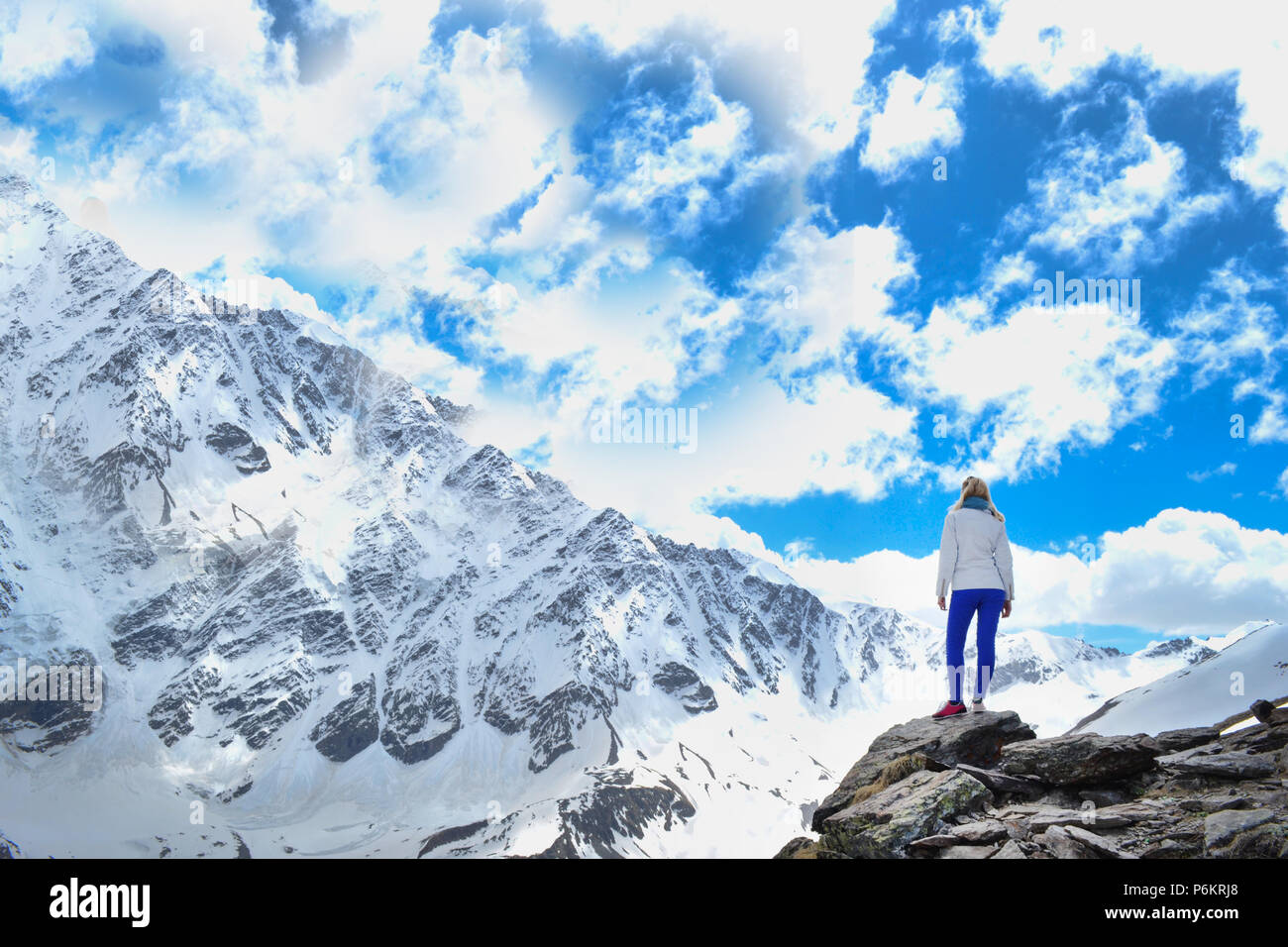 Mountain view.Blonde girl in the mountains Stock Photo - Alamy