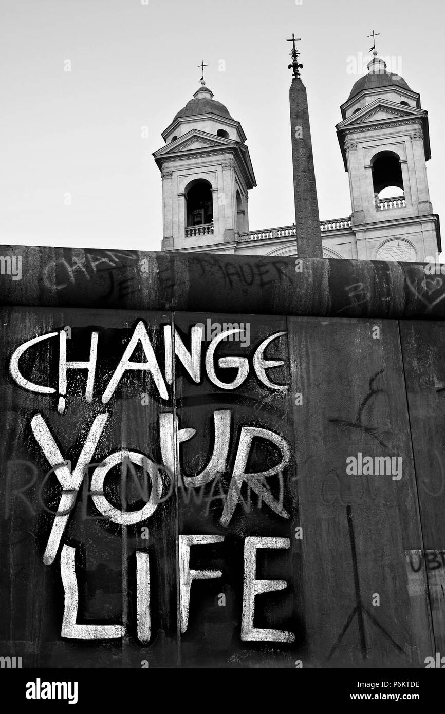Change your life written on the wall in foreground and christianity ...