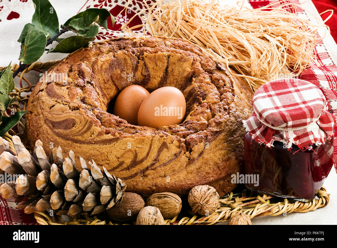 Rustic still life shot of whole angel food cake with two brown egg ...