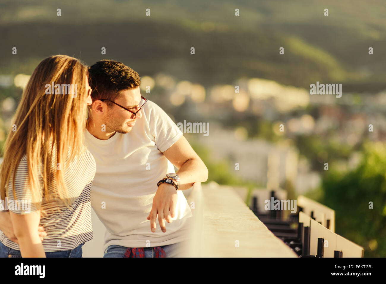 Cute couple relaxing and enjoying in panorama on the city Stock Photo ...