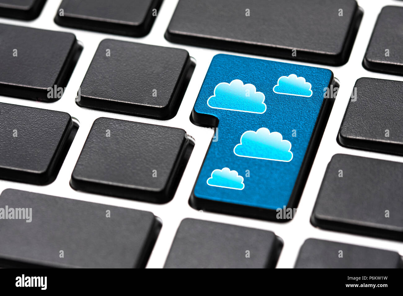 Cloud computing concept showing cloud icons on computer key Stock Photo ...