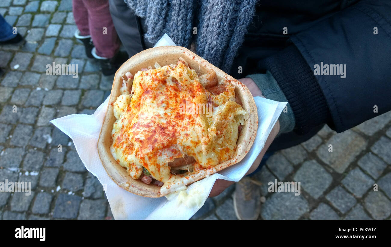 Traditional raclette dish served at German christmasmarket Stock Photo ...