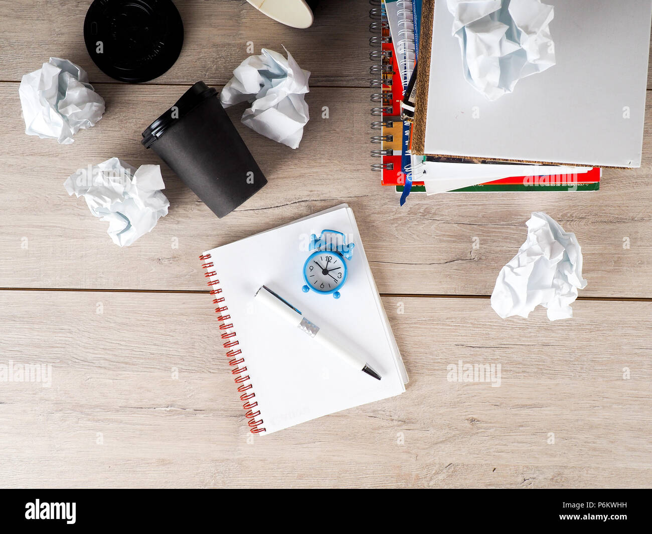 Still life with crumpled paper on books page and books stack background ...