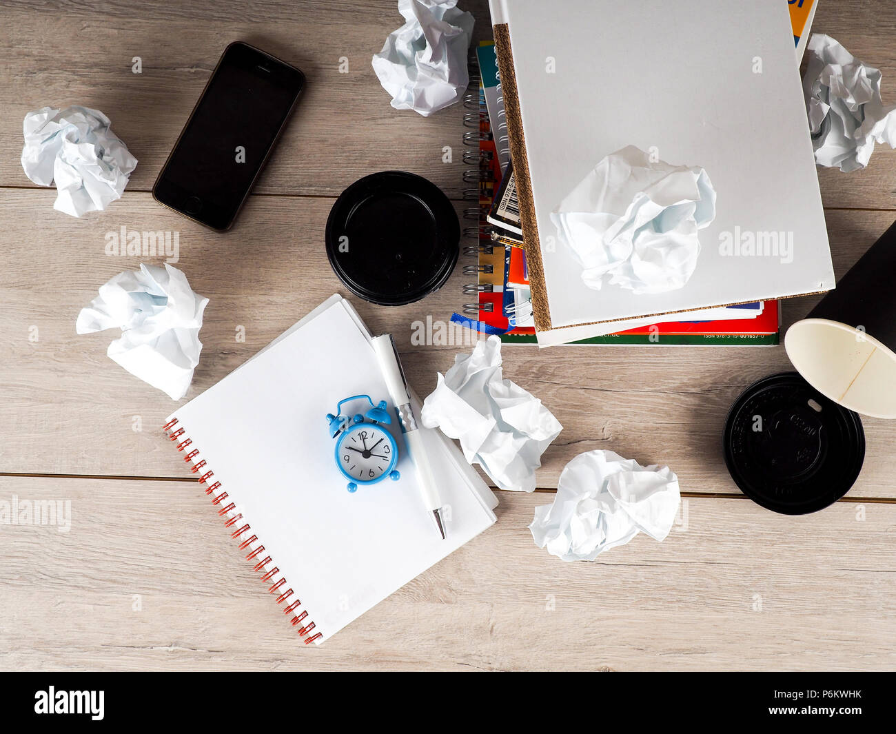 Still life with crumpled paper on books page and books stack background ...