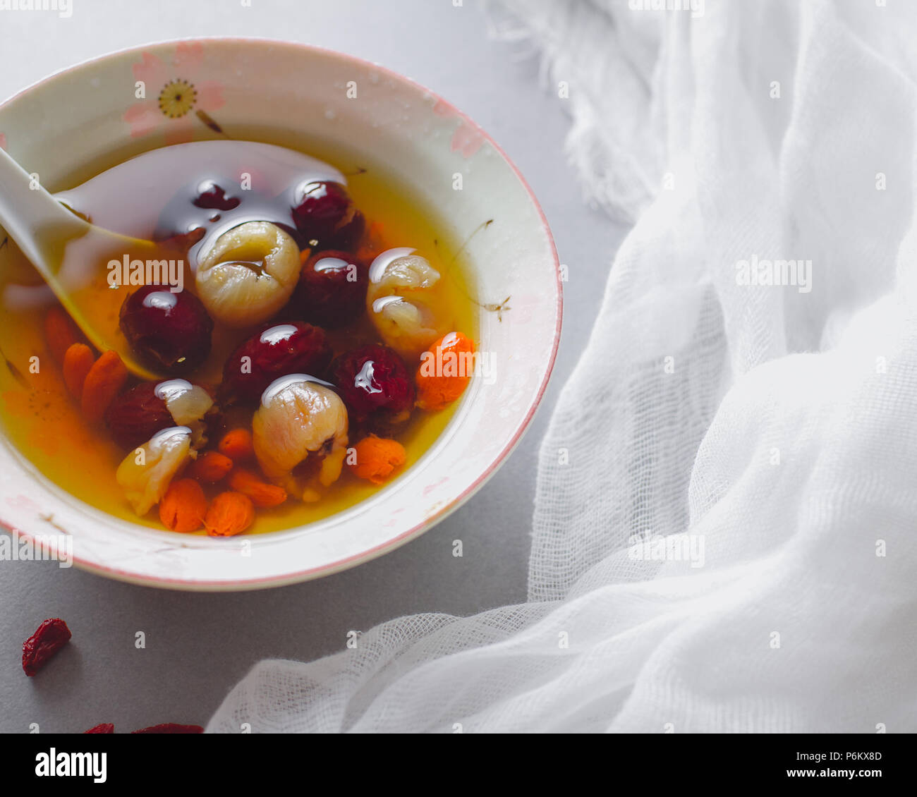Red Date Longan Soup in Pink Bowl, healthy Stock Photo - Alamy