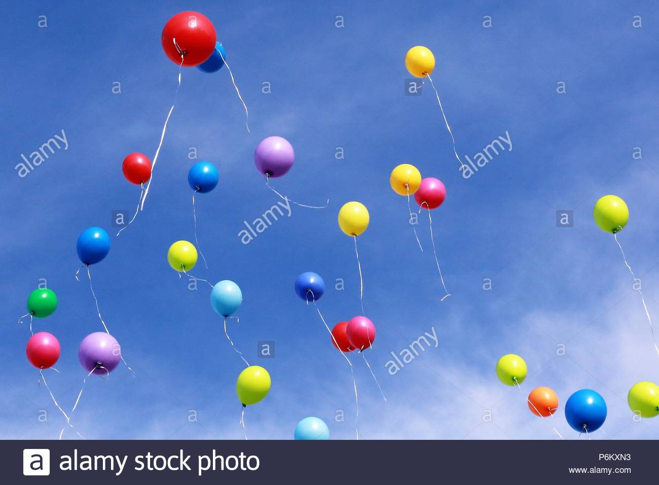 Colourful balloons head skywards on a lovely evening in June Stock ...