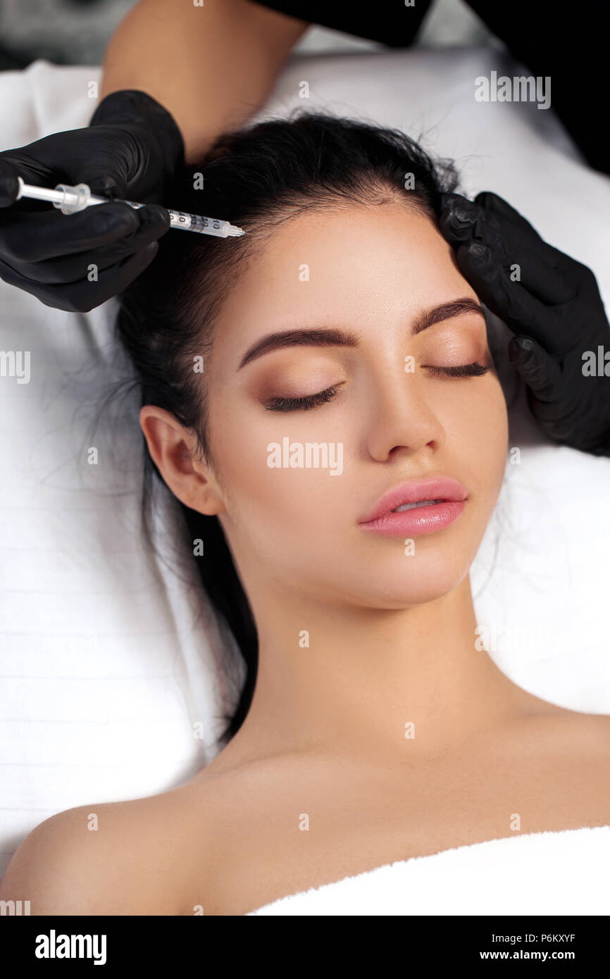 woman getting injection Stock Photo - Alamy