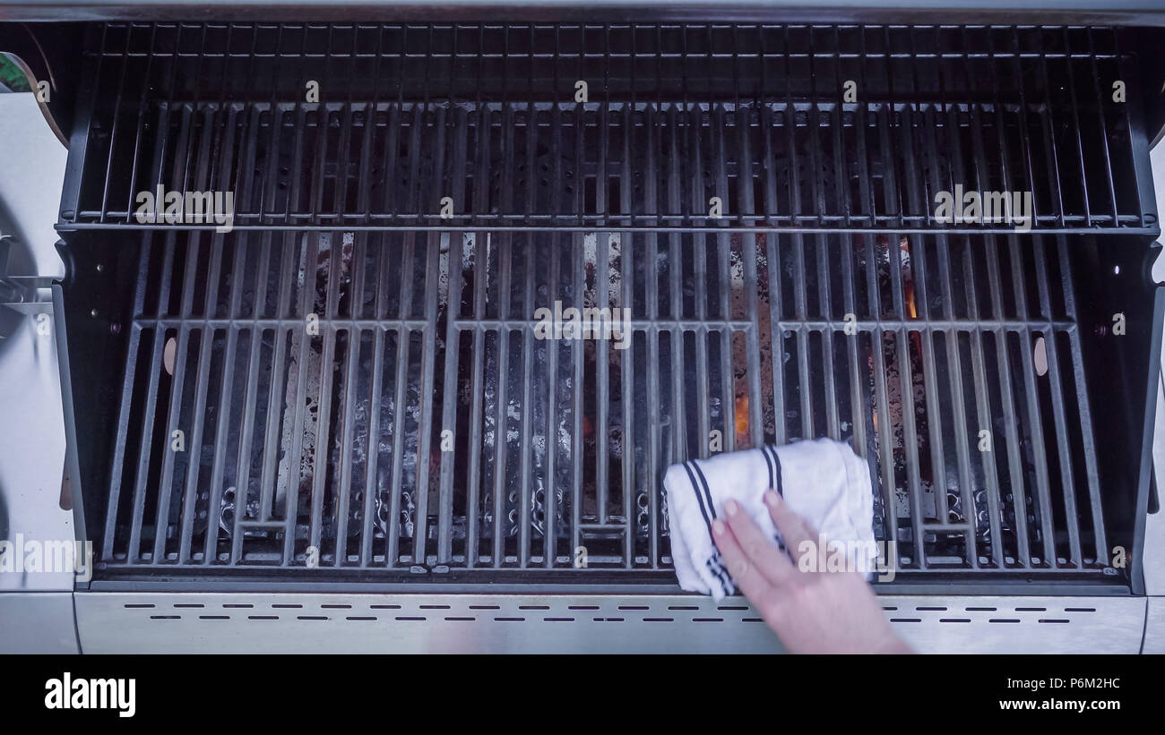 Step by step. Cleaning outdoor gas grill Stock Photo - Alamy