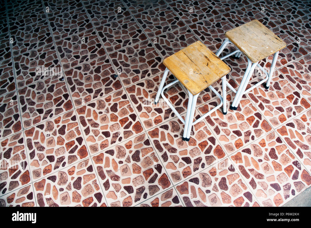 two stools in an empty room on tiled floor in Thailand Stock Photo - Alamy