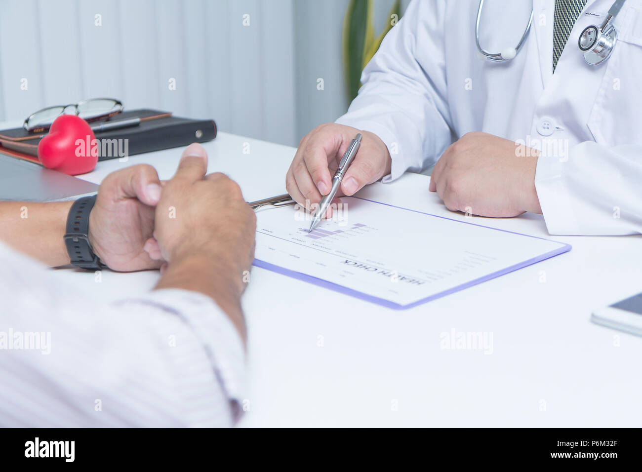 Doctor and patient are discussing something.- Health care concept Stock ...
