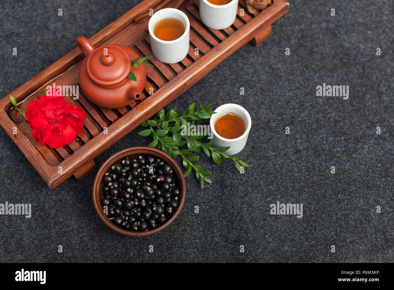Traditional Chinese tea ceremony with black currant, fruit tea and ...