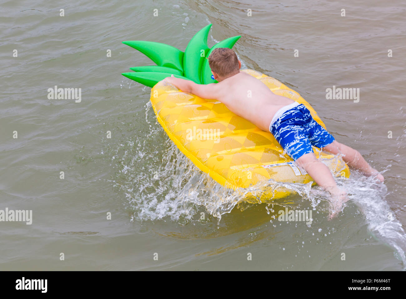 Laying on inflatable inflatables hi-res stock photography and images ...