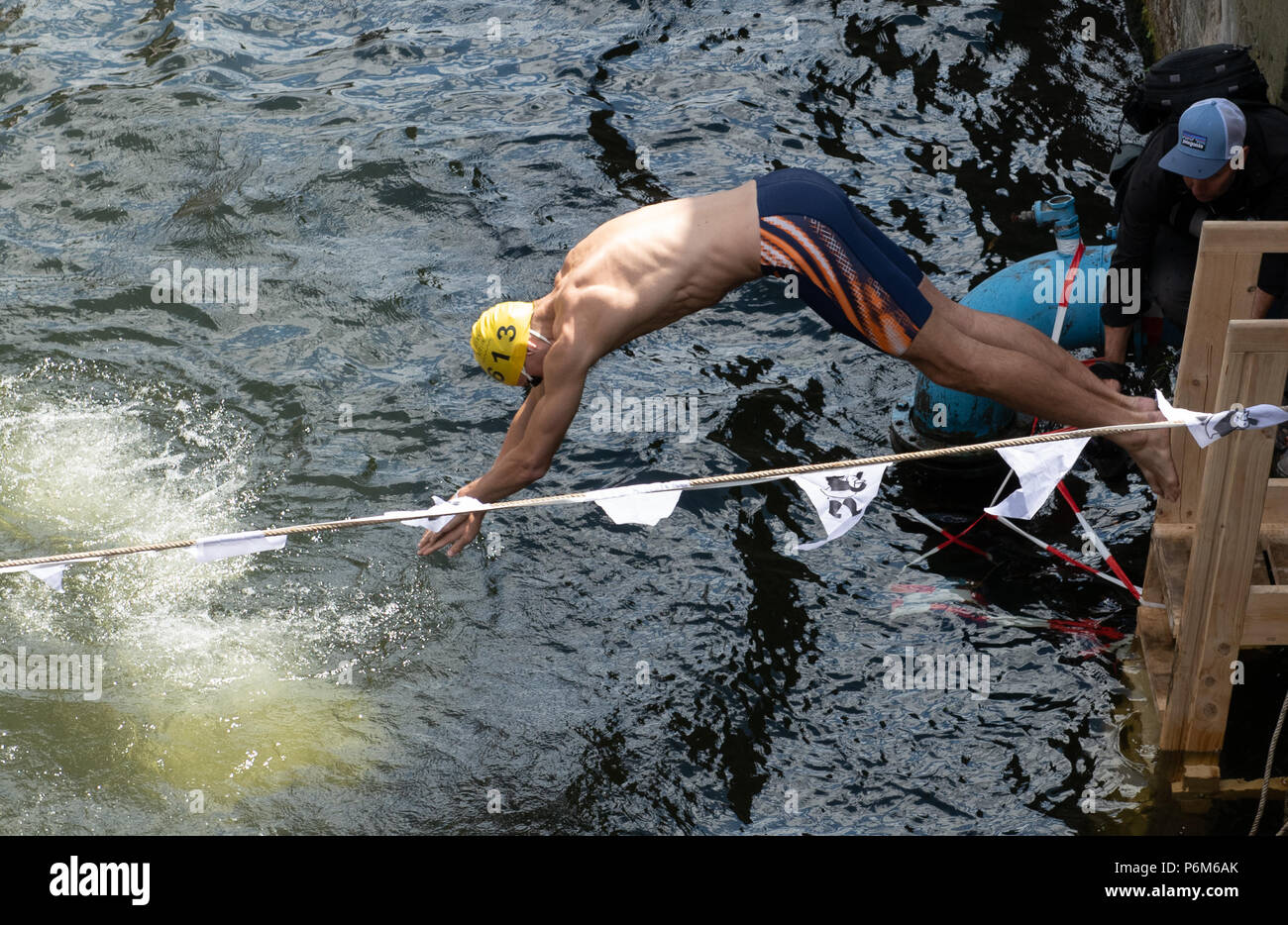 Berlin, Germany. 01st July, 2018. A participant takes a leap into the ...