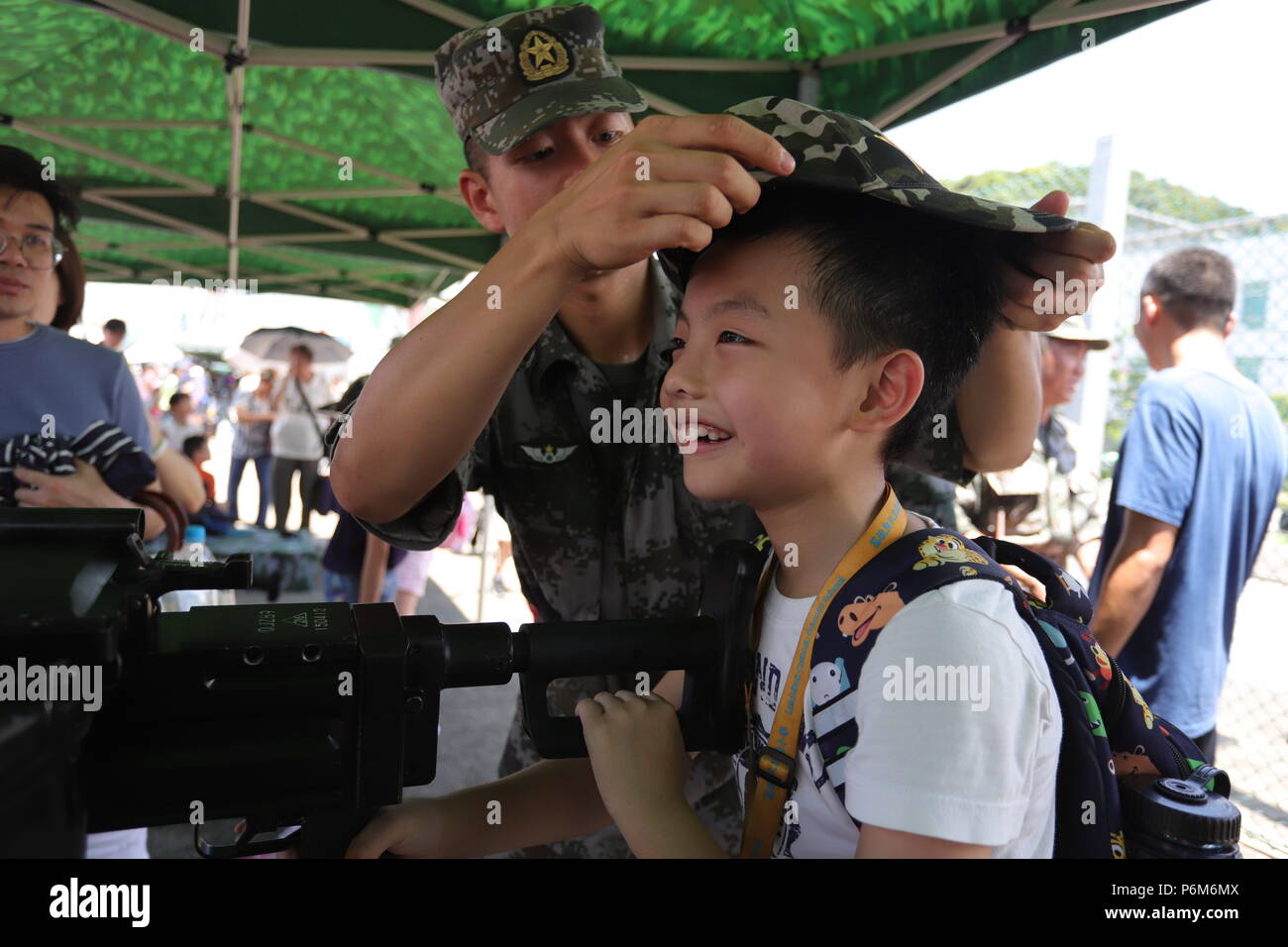 Hong Kong, CHINA. 1st July, 2018. PLA soldier reverse the cap on the ...