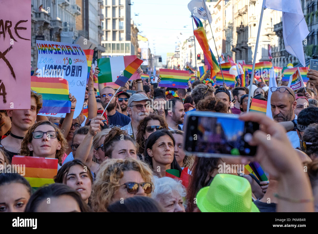 Milan, Italy. 30th Jun, 2018. Crowd of people holding flags and ...