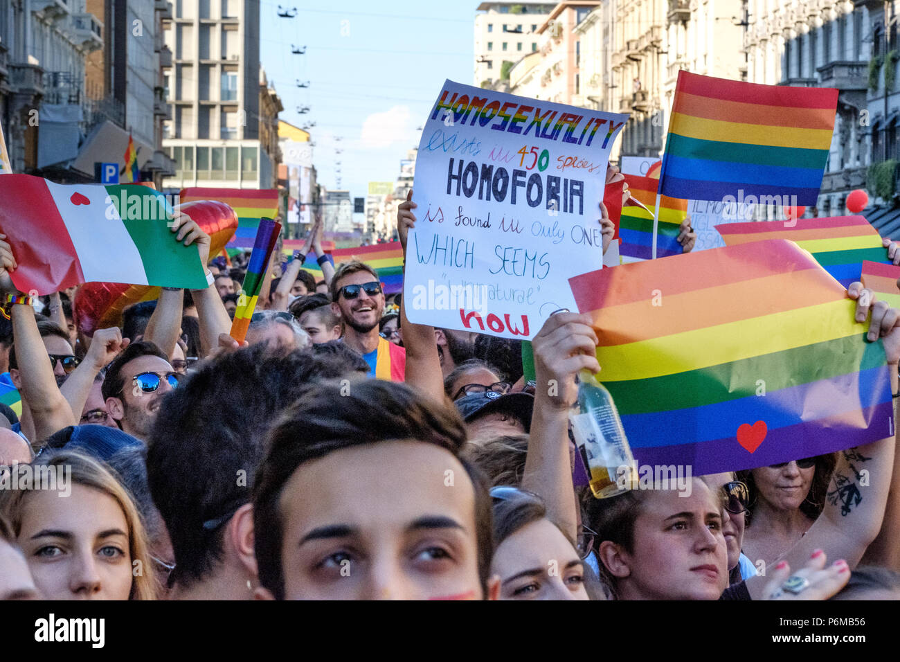 Milan, Italy. 30th Jun, 2018. Crowd of people holding rainbow flags and ...