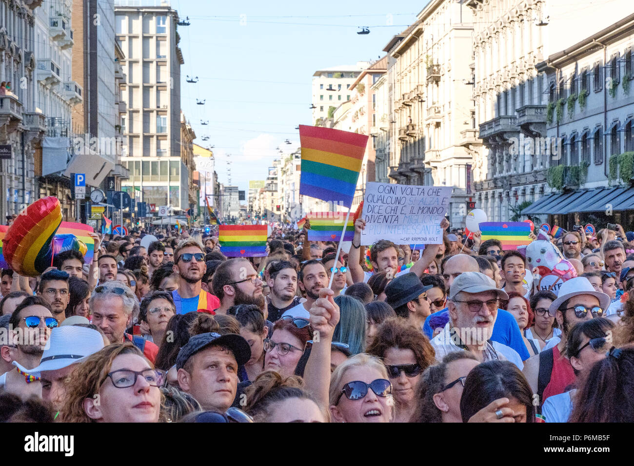 Milan, Italy. 30th Jun, 2018. Crowd of people holding rainbow flags and ...