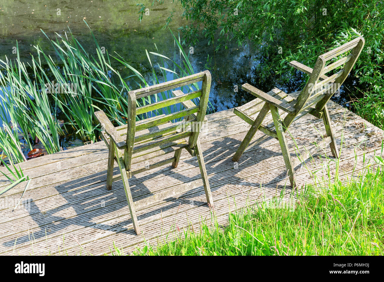 Weathered wooden chairs hi-res stock photography and images - Alamy
