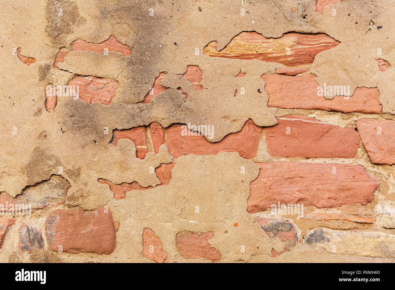 background texture of flaking plaster on an old brick wall Stock Photo ...