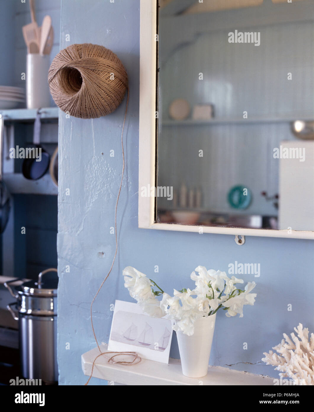 Close-up of a large ball of string on a wall in a blue economy style ...