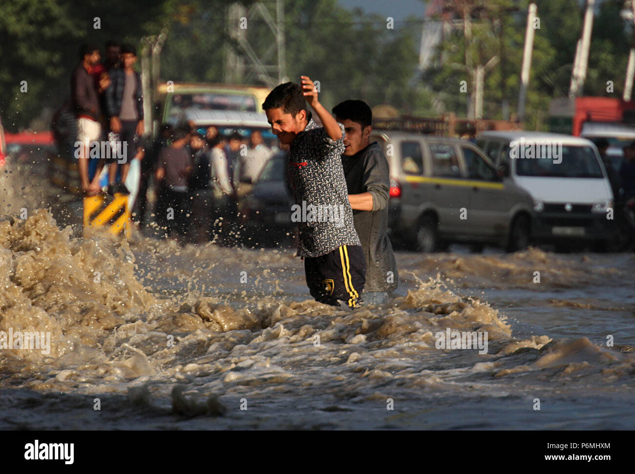 Two boys in river floods hi-res stock photography and images - Alamy