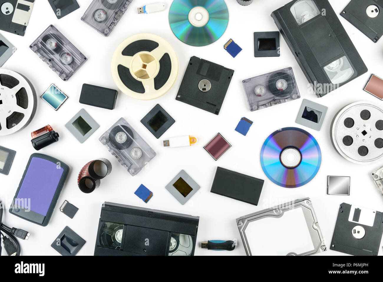 Old retro technology and new media on a white background. Flat lay ...