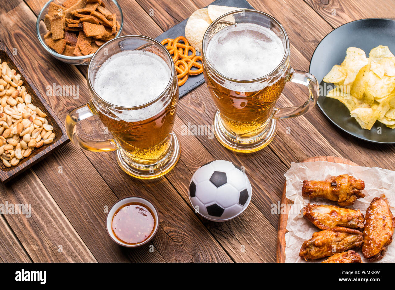 Appetizers and beer on the table for watch the football match Stock ...