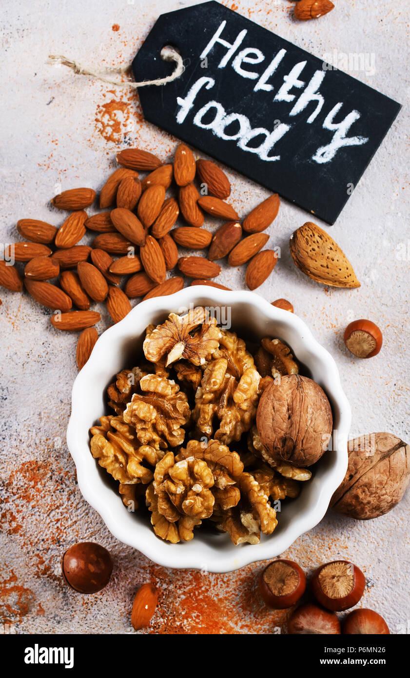 Mix nuts on beton background. Cut nuts Stock Photo - Alamy