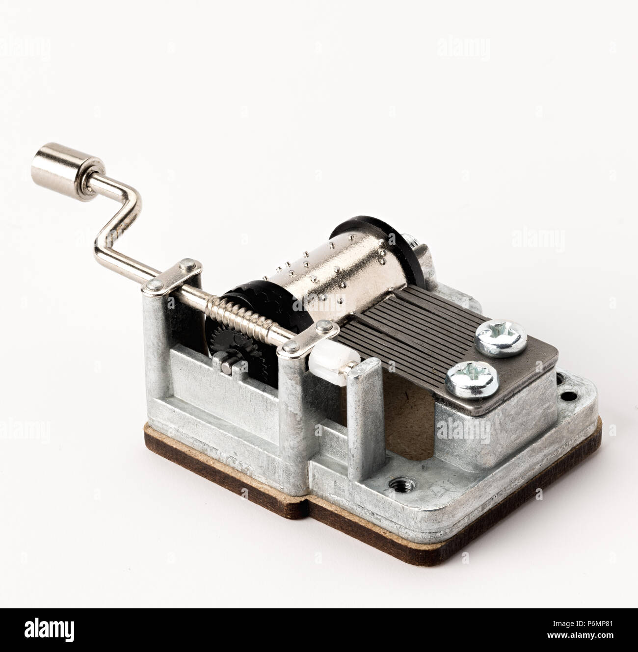 Small crank music box workings made of metal Stock Photo - Alamy