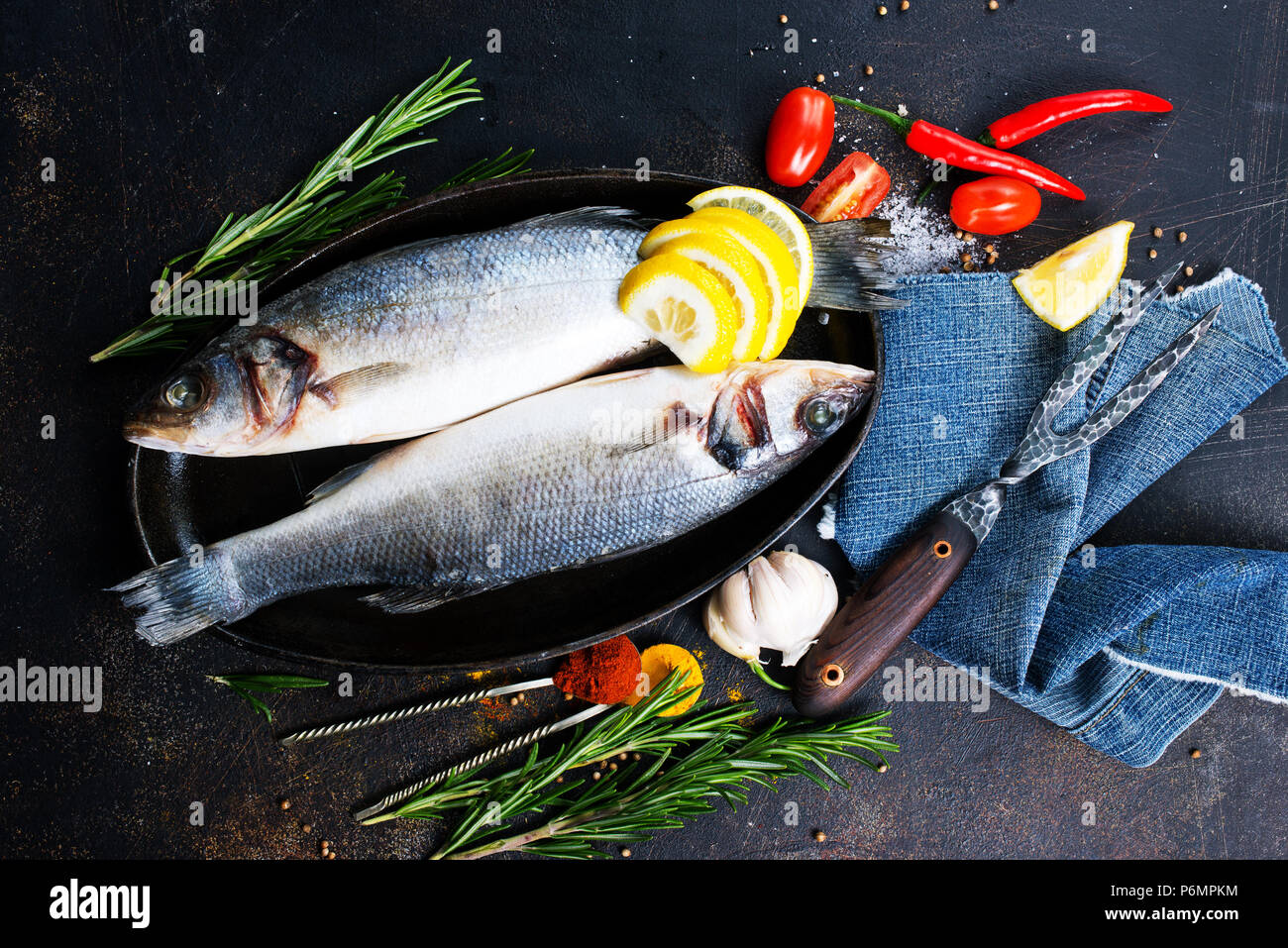 raw fish with lemon salt and pepper Stock Photo - Alamy