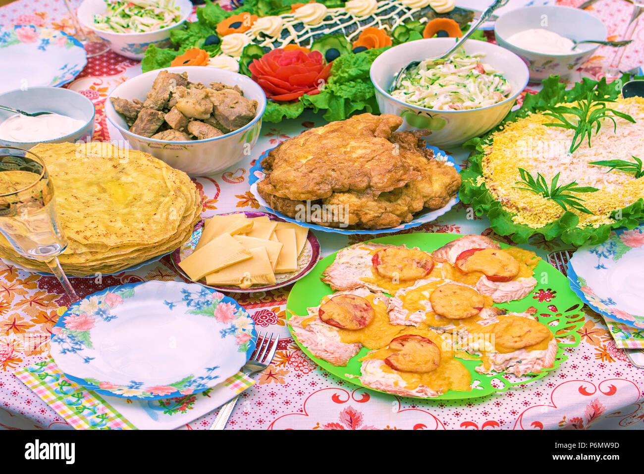Round table full of food. Meal on the round table Stock Photo - Alamy