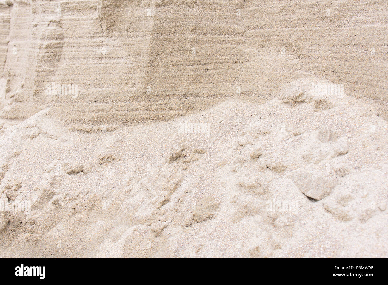 Sand in the quarry. Pile sand for construction Stock Photo - Alamy