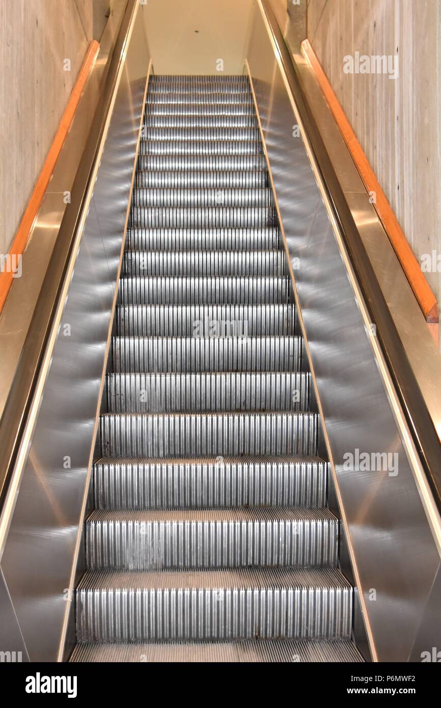 Building escalator going up Stock Photo - Alamy