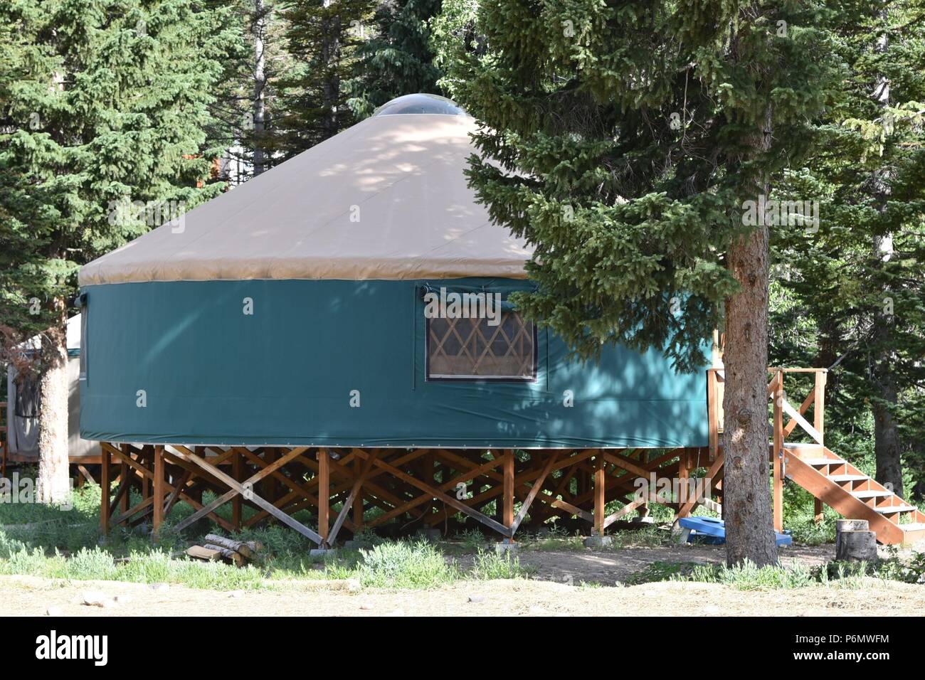 A yert in the mountains by a creek Stock Photo - Alamy