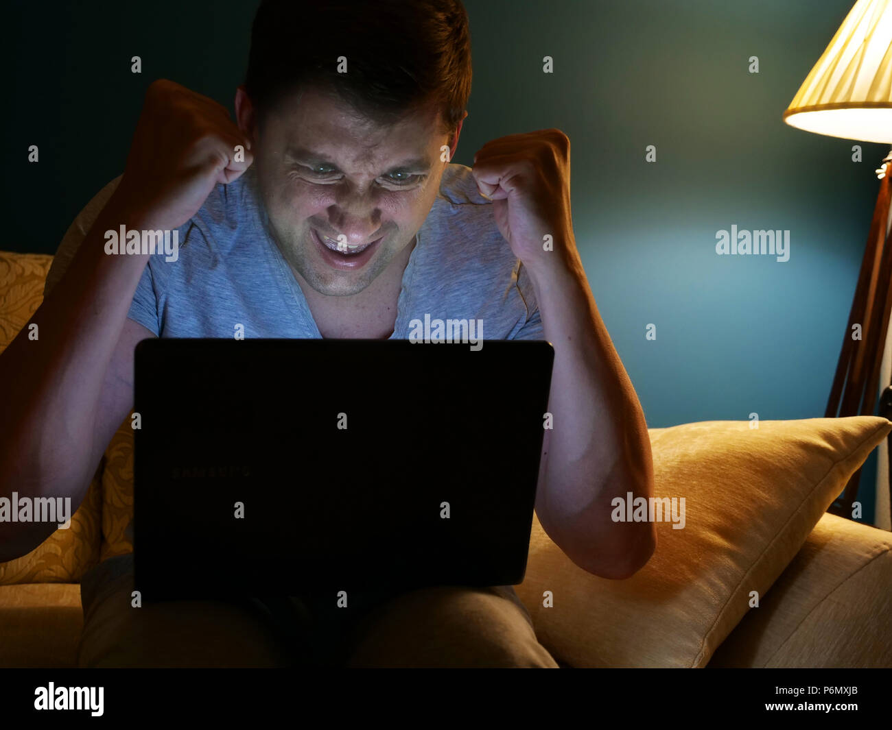 Excited young man watching something hi-res stock photography and ...
