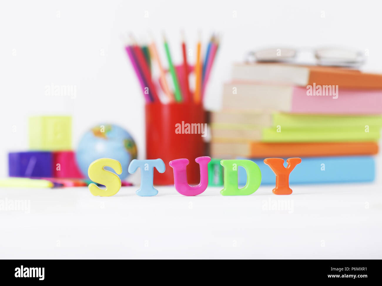 word study on blurred background of school supplies .photo with copy ...