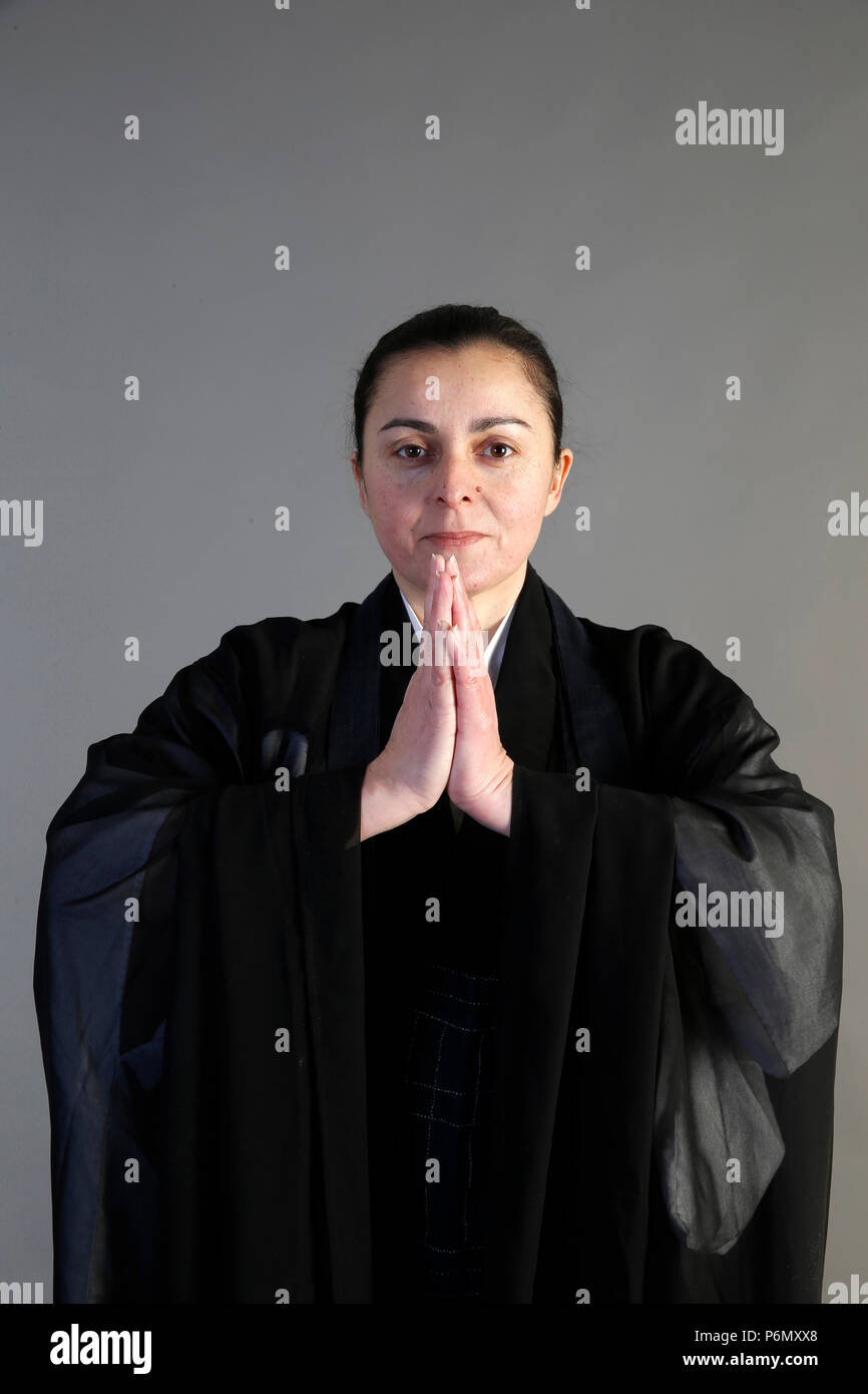 Zen buddhist doing "gasho". Paris, France Stock Photo - Alamy