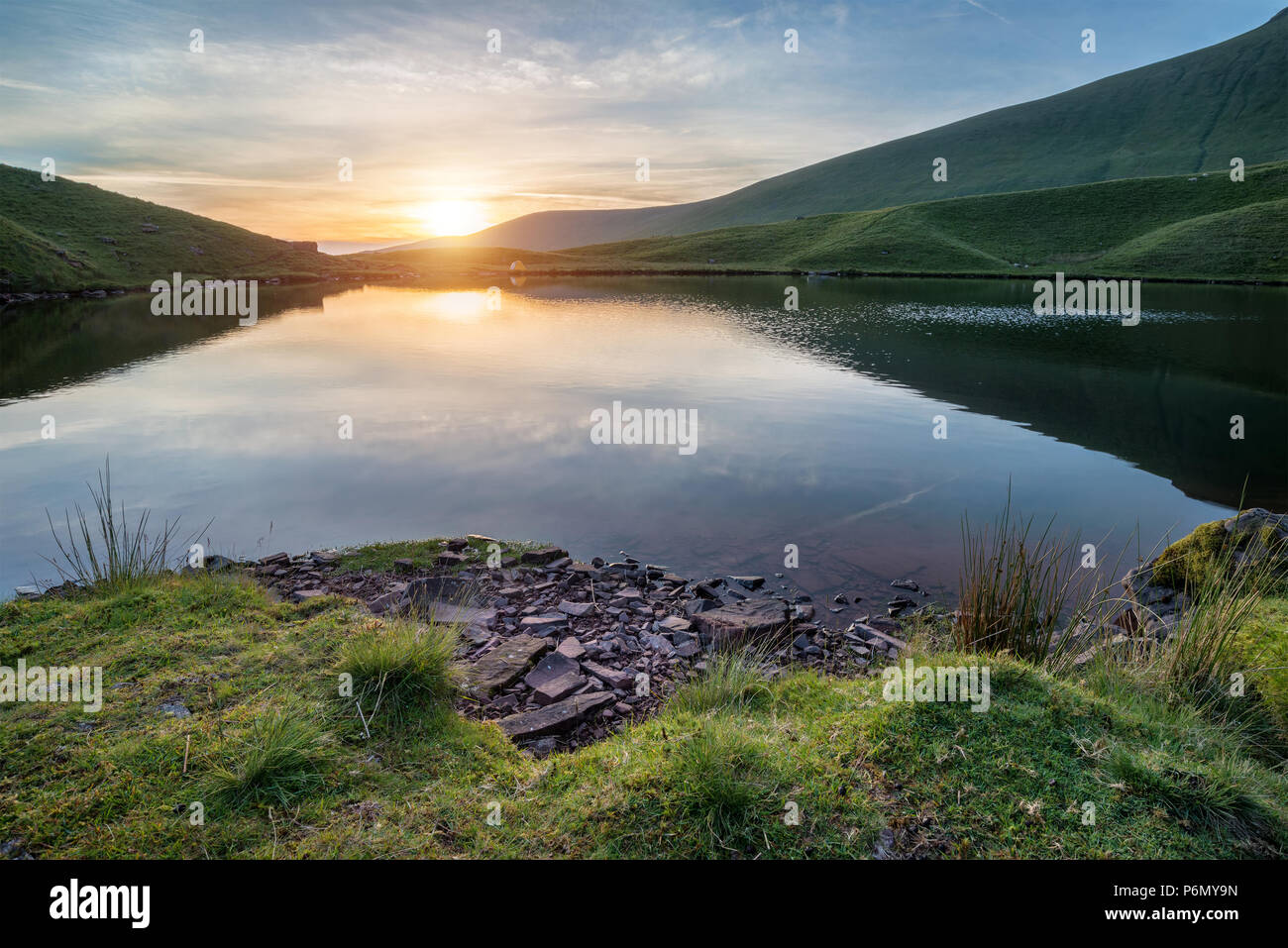 Beautiful Summer sunrise landscape by Llyn Cwm Llwch lake in Brecon ...