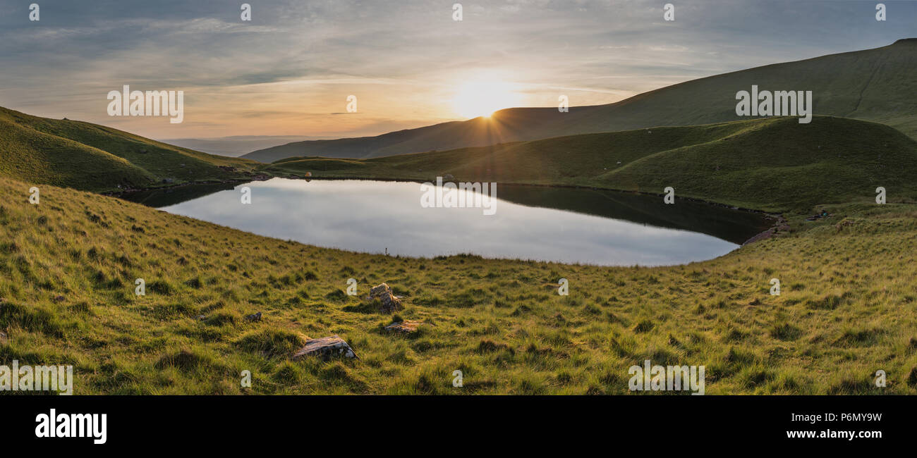 Beautiful Summer sunrise landscape by Llyn Cwm Llwch lake in Brecon ...