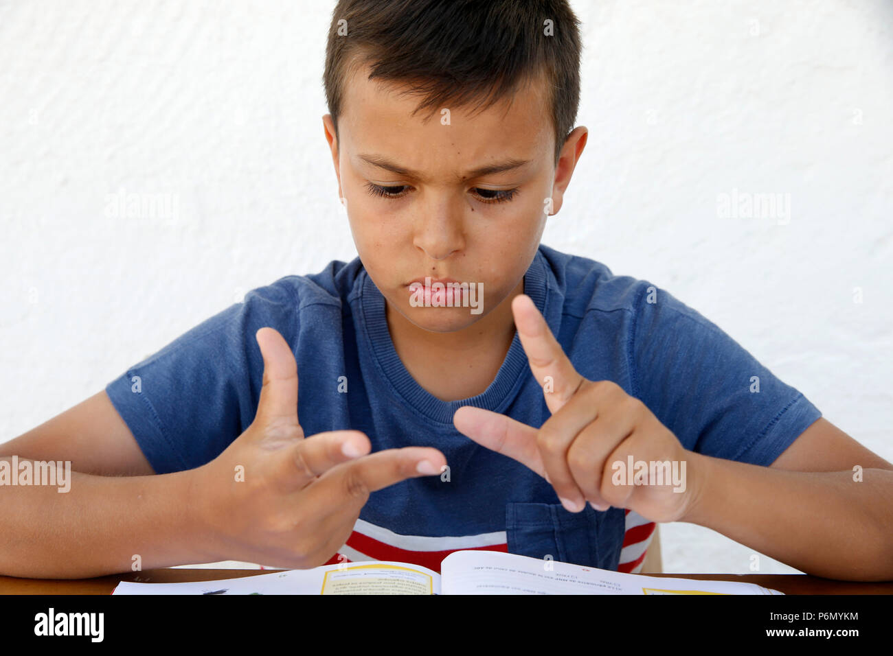 11-year-old boy doing homework in Salento, Italy Stock Photo - Alamy