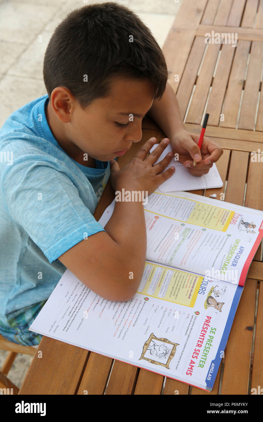 11-year-old boy doing homework in Salento, Italy Stock Photo - Alamy