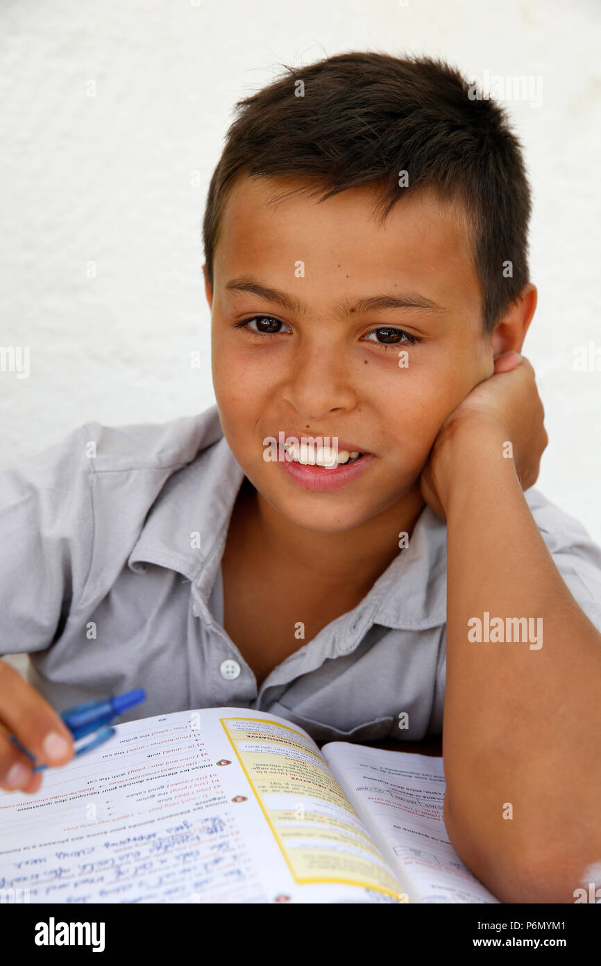 11-year-old boy doing homework in Salento, Italy Stock Photo - Alamy
