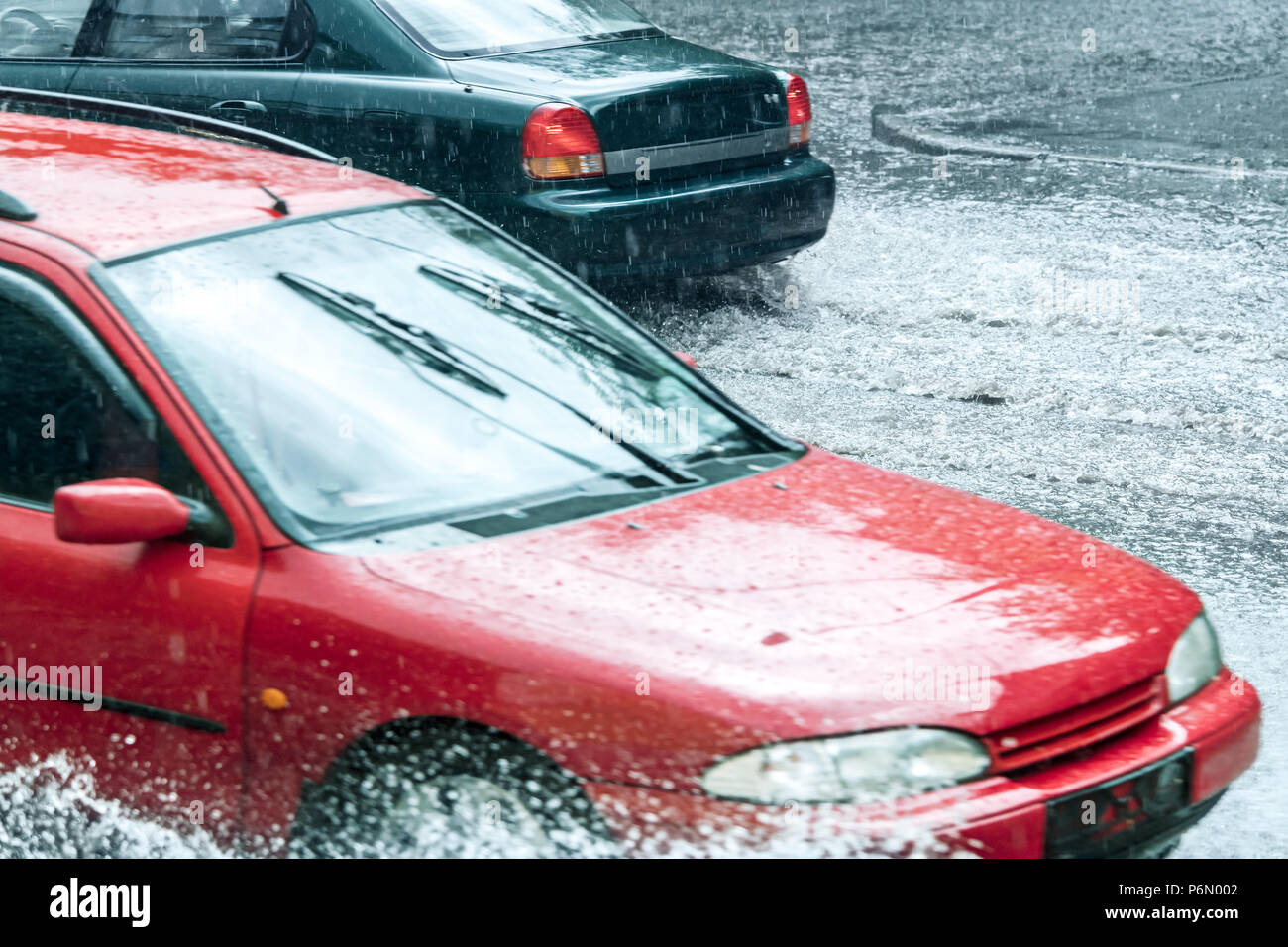 city traffic during heavy rain moving along wet road Stock Photo - Alamy
