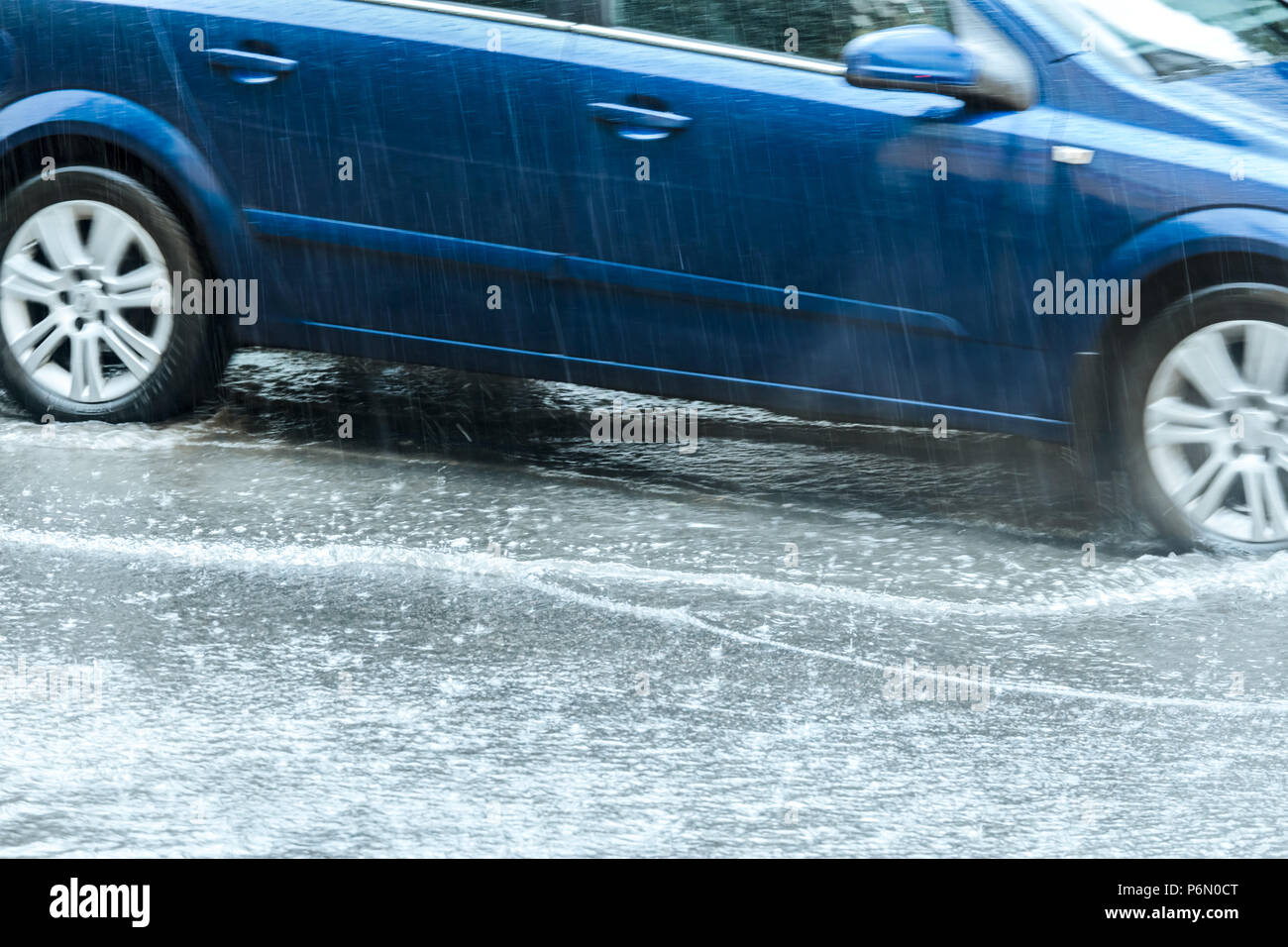 car in motion during heavy rain, flooded city road Stock Photo - Alamy