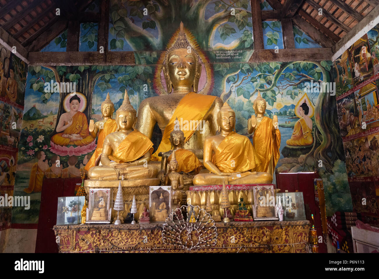 Laos temple bas relief gold buddha hi-res stock photography and images ...