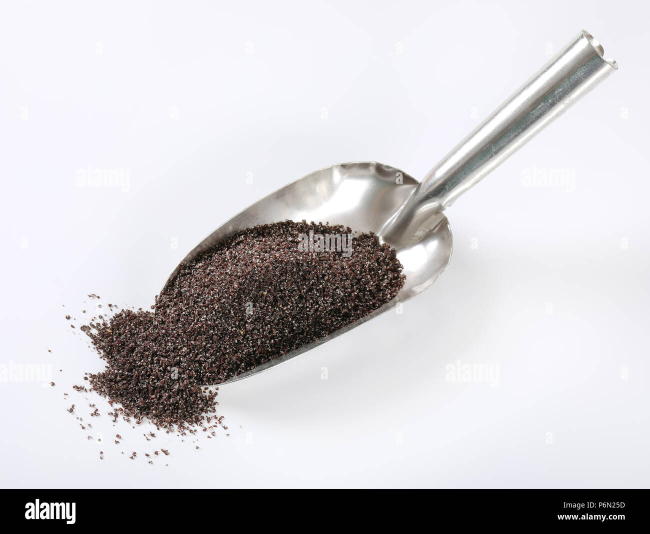 scoop of ground poppy seeds on white background Stock Photo - Alamy