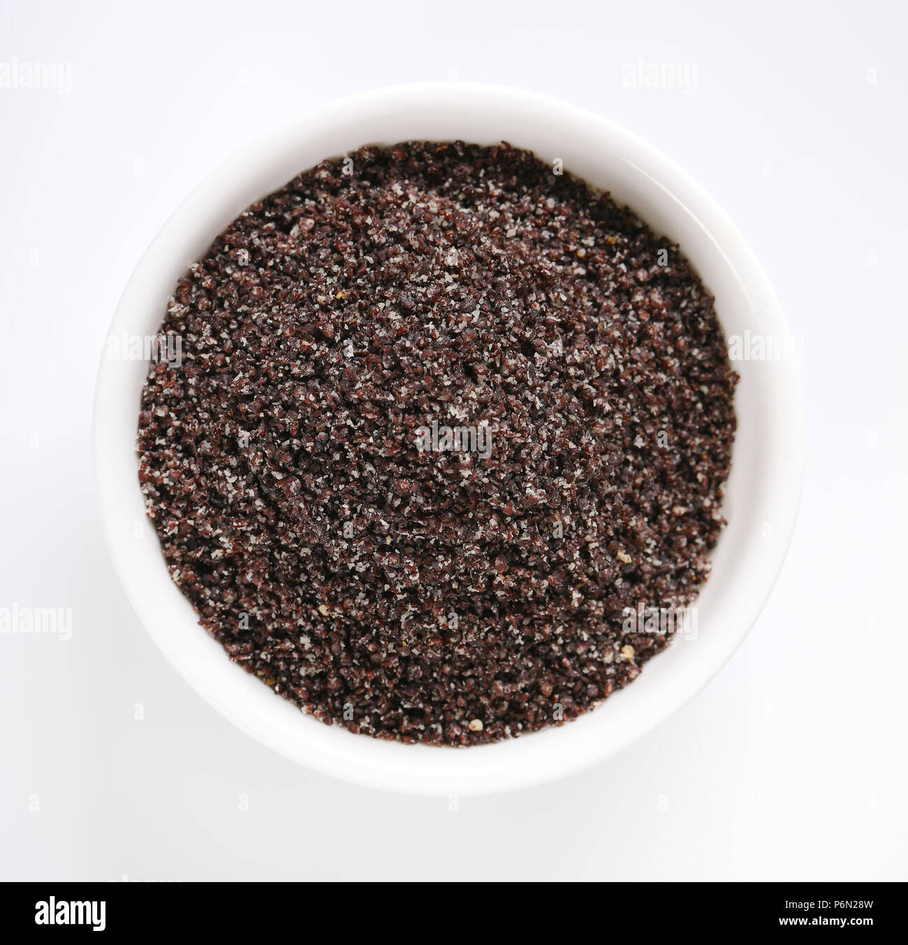 bowl of ground poppy seeds on white background Stock Photo - Alamy