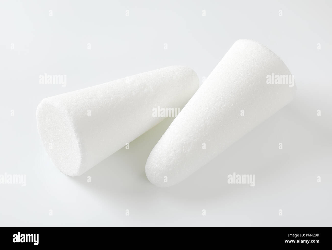 two white sugar loaves or cones on white background Stock Photo - Alamy