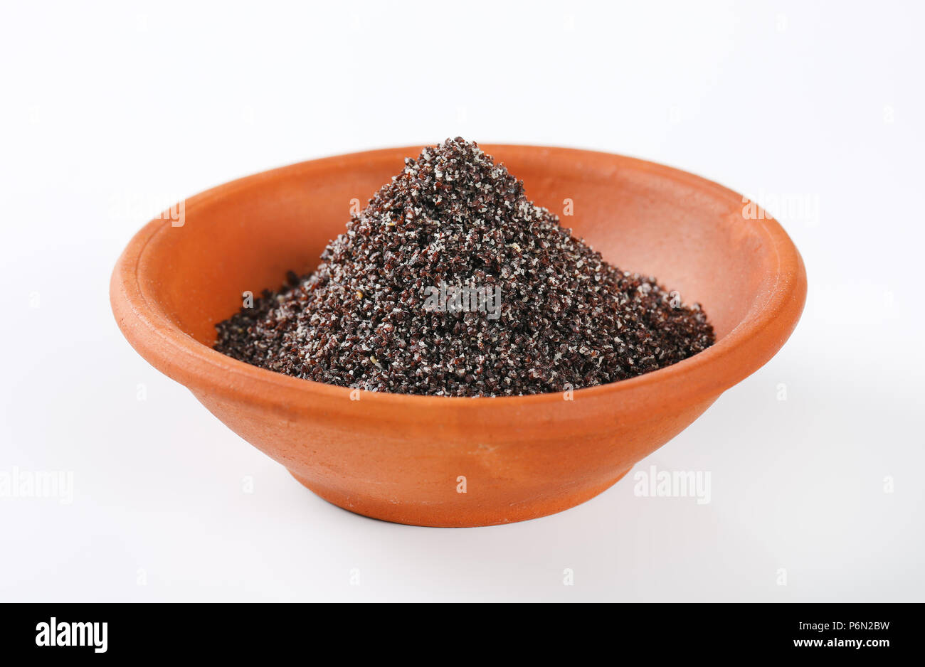 bowl of ground poppy seeds on white background Stock Photo - Alamy