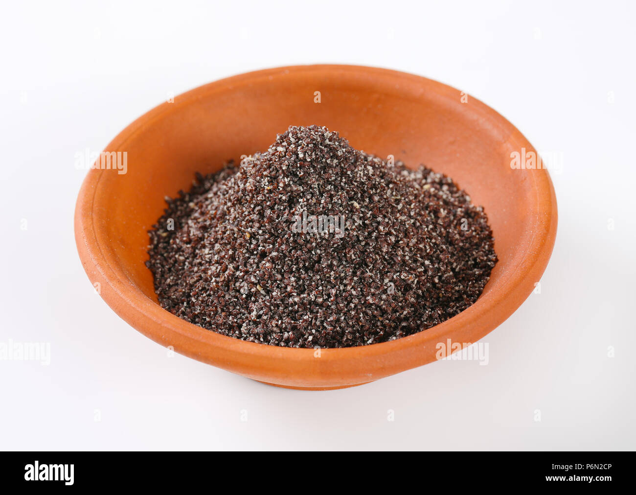 bowl of ground poppy seeds on white background Stock Photo - Alamy